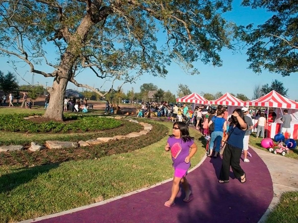 Riverstone families walk the purple pathway circling the new Big ...