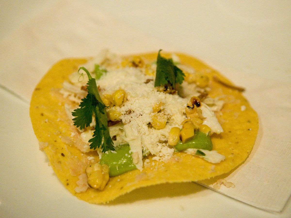 Blue crab tostada had a tasty salty crunch, but the crab's flavor got ...