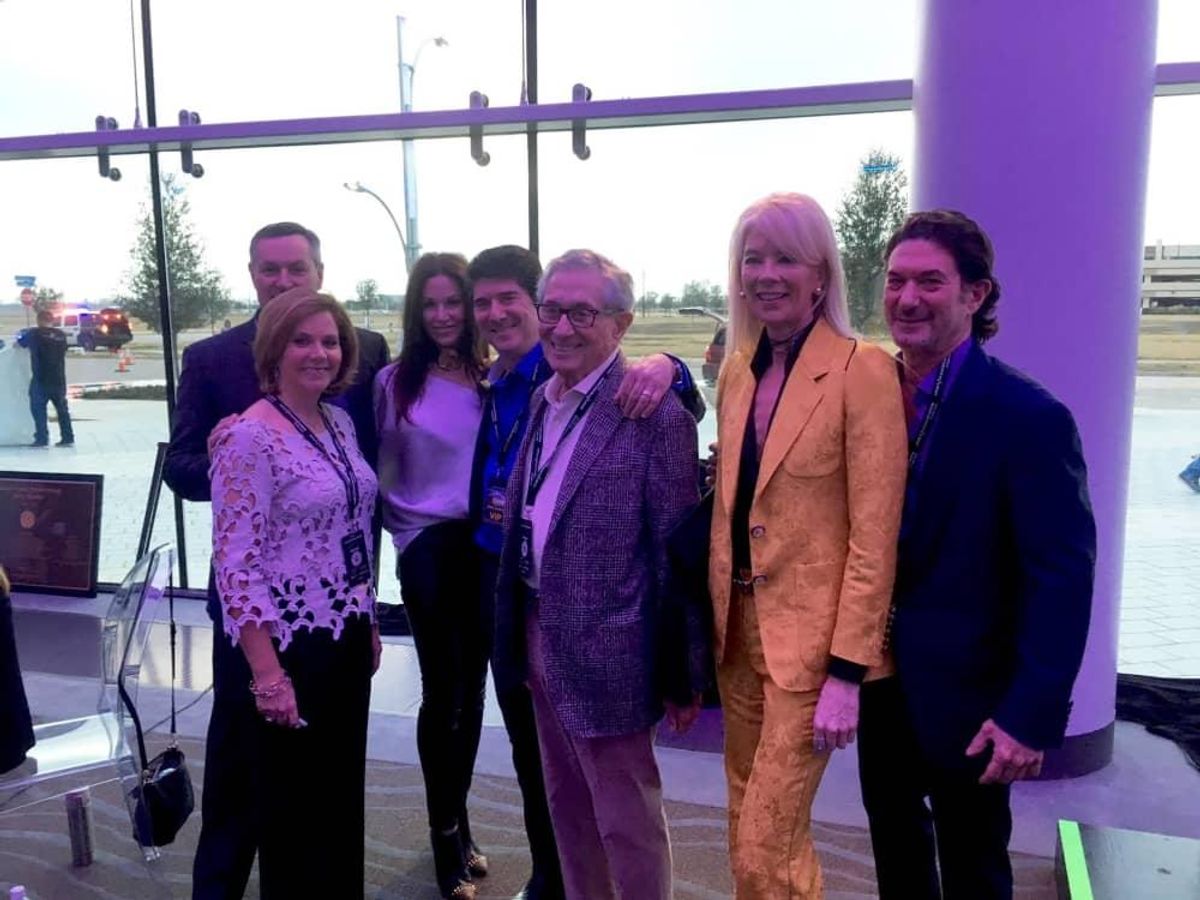 Allen Becker, center, celebrated the opening of the Smart Financial ...