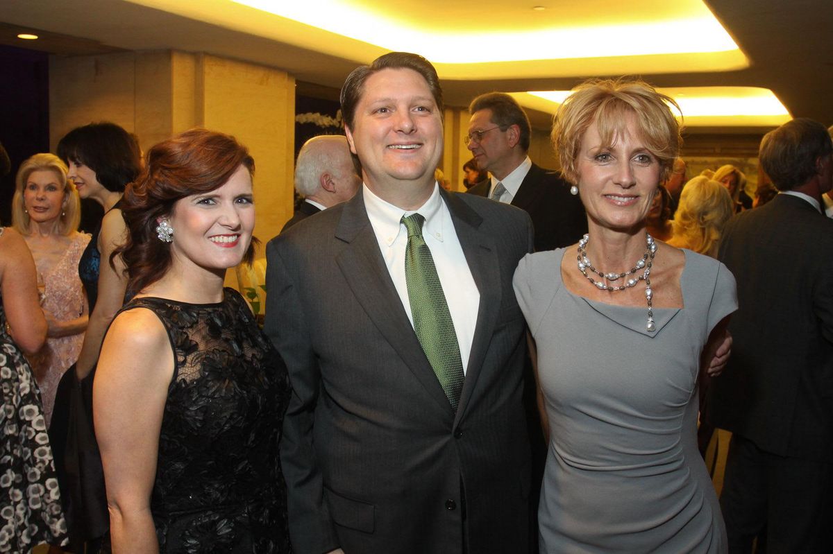 Heather and Chris Enright, left, with Shan Hinton at the Alley Theatre ...