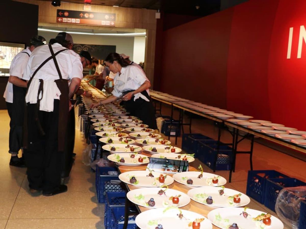 Plating a round of courses. - CultureMap Houston
