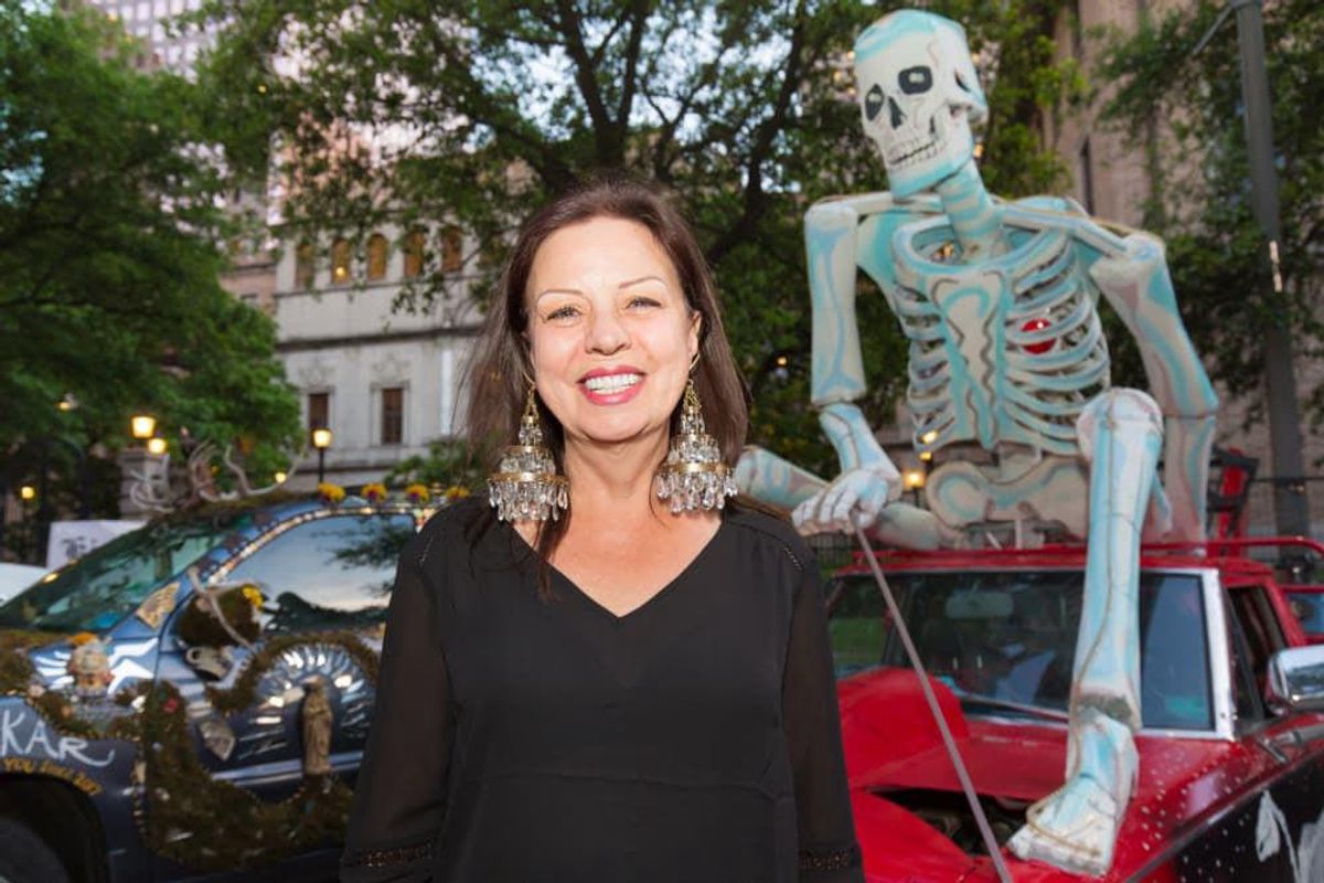 Audrey Crowson of Houston, wearing chandelier earrings, poses in from ...