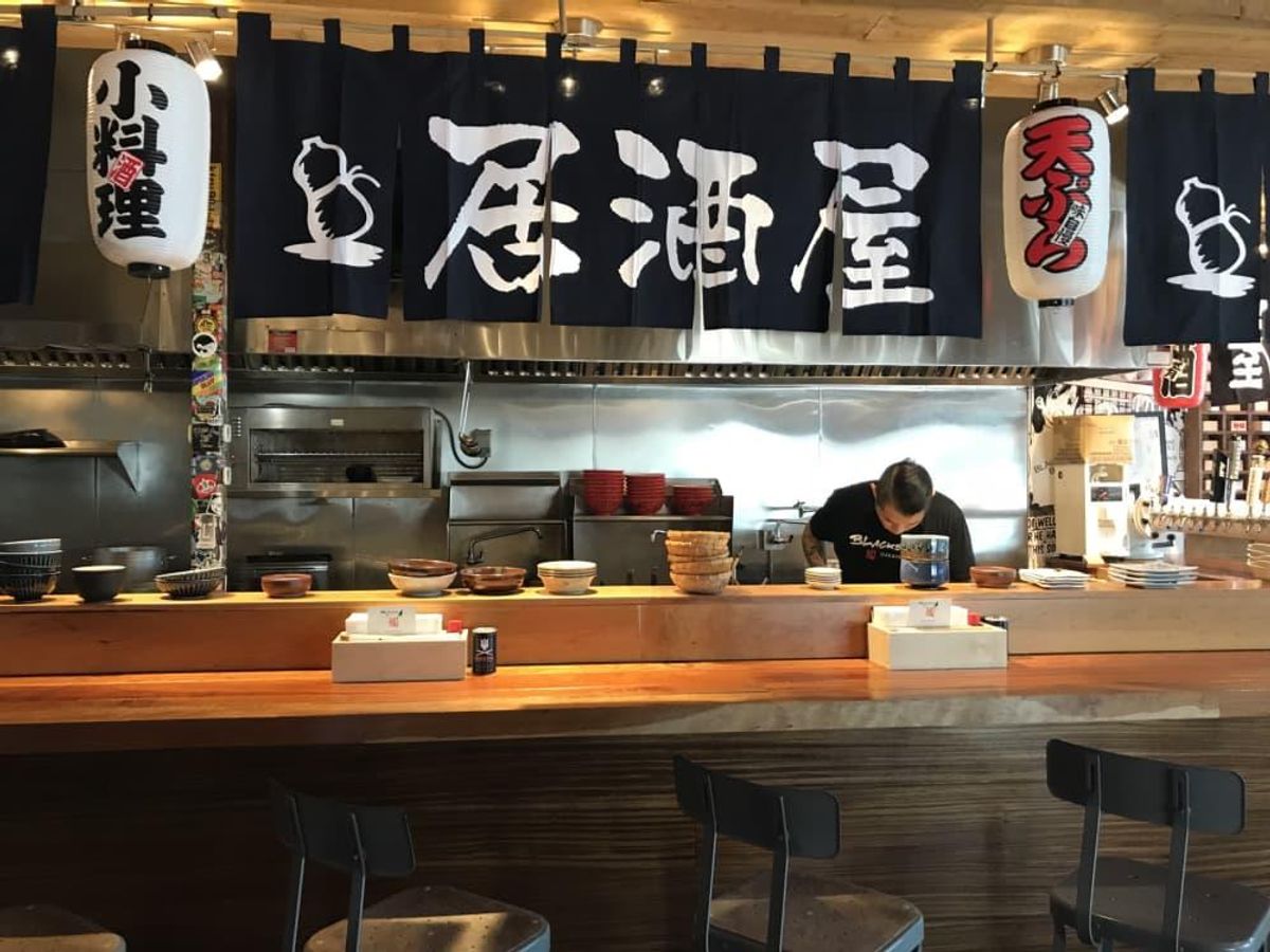 Chef Billy Kin prepares a dish. - CultureMap Houston