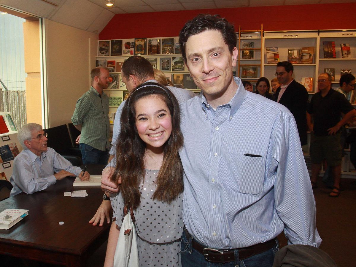 Caitlin Berg and older brother Goeff Berg at the book signing for their father's tome Run ...
