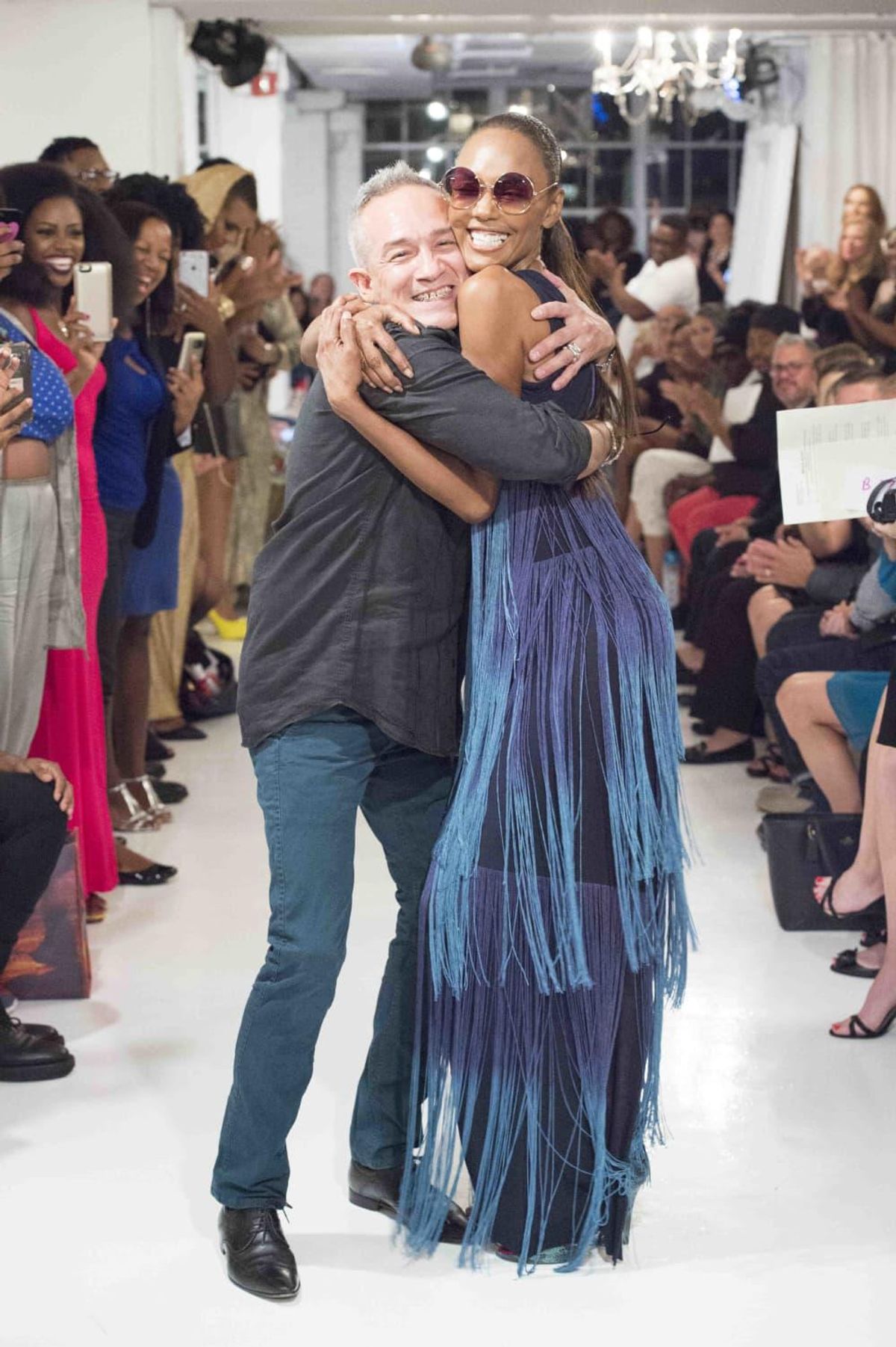 Cesar Galindo hugs model at the end of the runway show for his Czar by ...