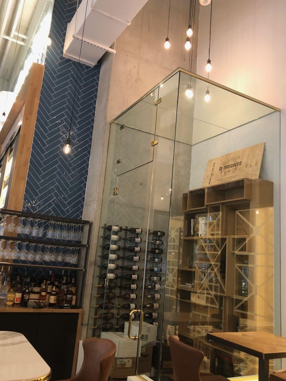 A look at the vertical wine tower. - CultureMap Houston