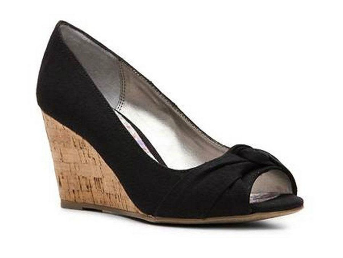 A classic black wedge can easily take you from the office to a play ...