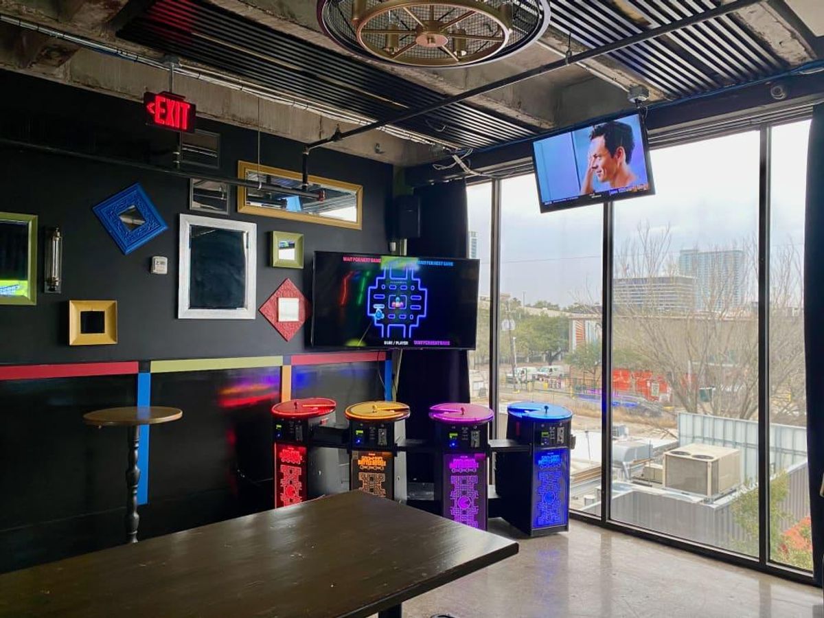 The retro space features arcade games like PAC-MAN. - CultureMap Houston