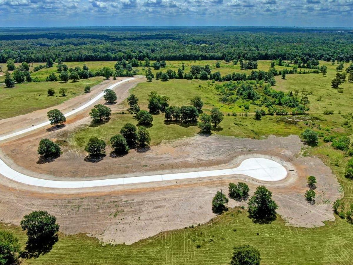 Future lots sit on rolling countryside. - CultureMap Houston