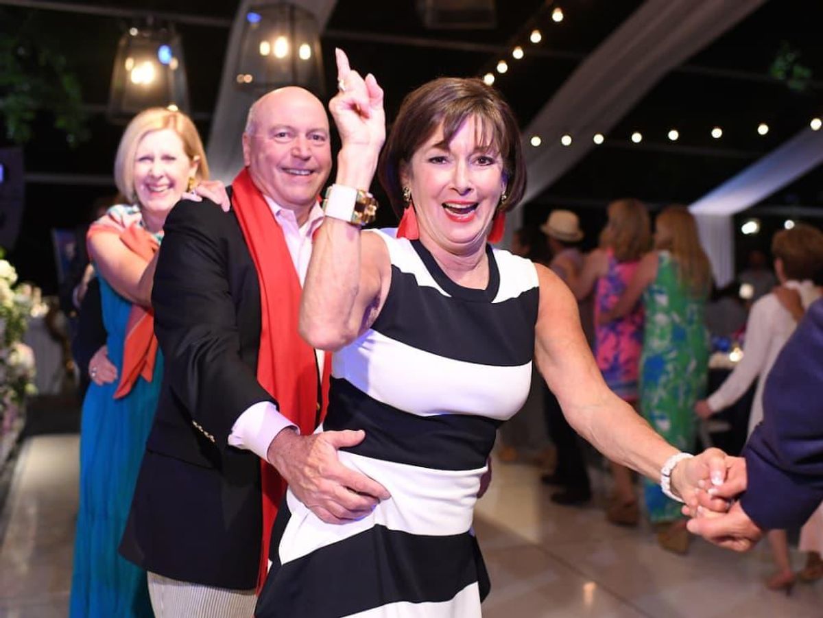 Cathy Cleary leads the conga line. - CultureMap Houston