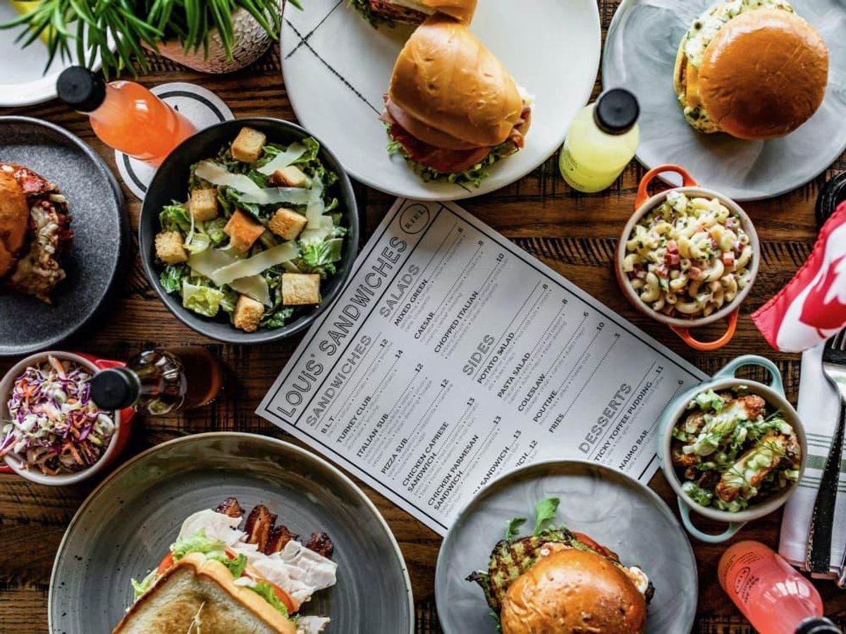 Louie's offers an array of sandwiches and sides. - CultureMap Houston