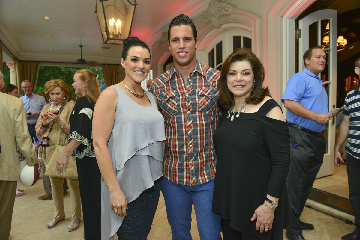 Megan and Brian Cushing, left, with Laura Ward. - CultureMap Houston
