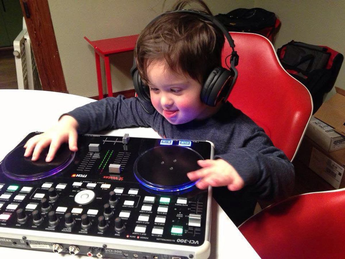 Milo Castillo, playing with his parent's DJ setup - CultureMap Houston