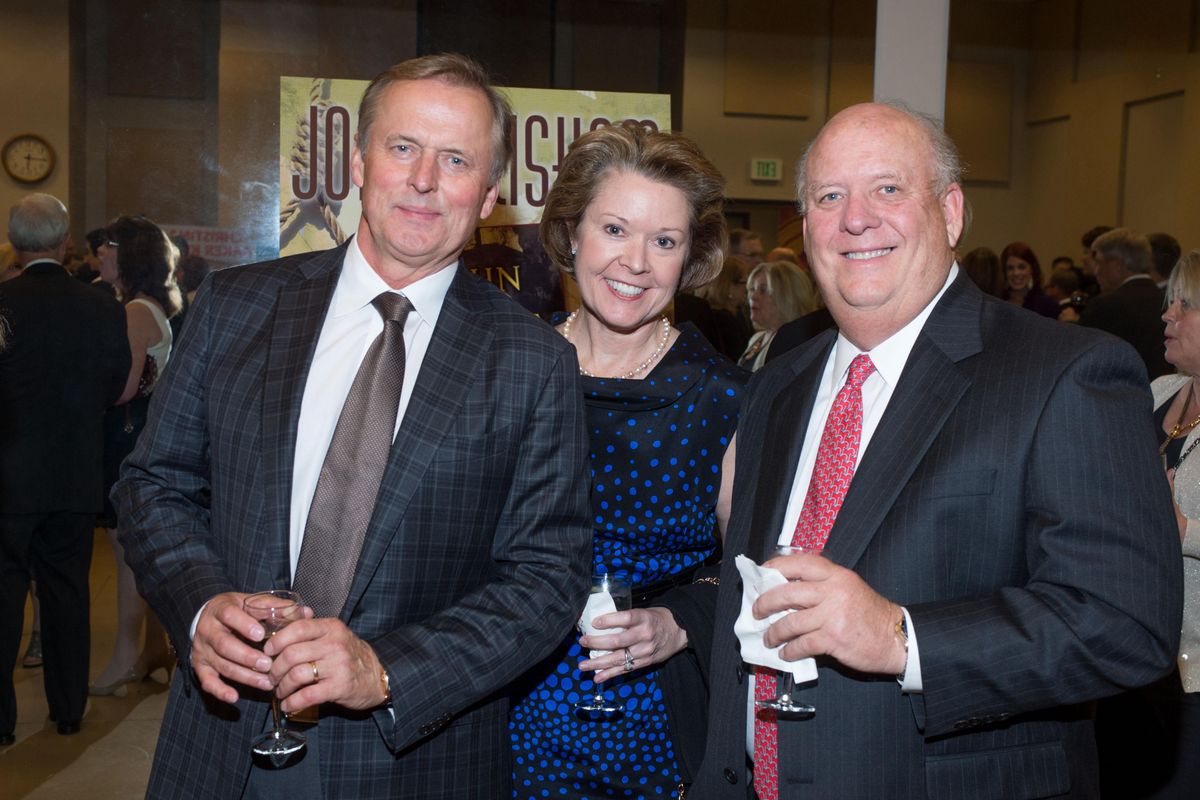 John Grisham, left, with Martha and Marc Carnes. - CultureMap Houston
