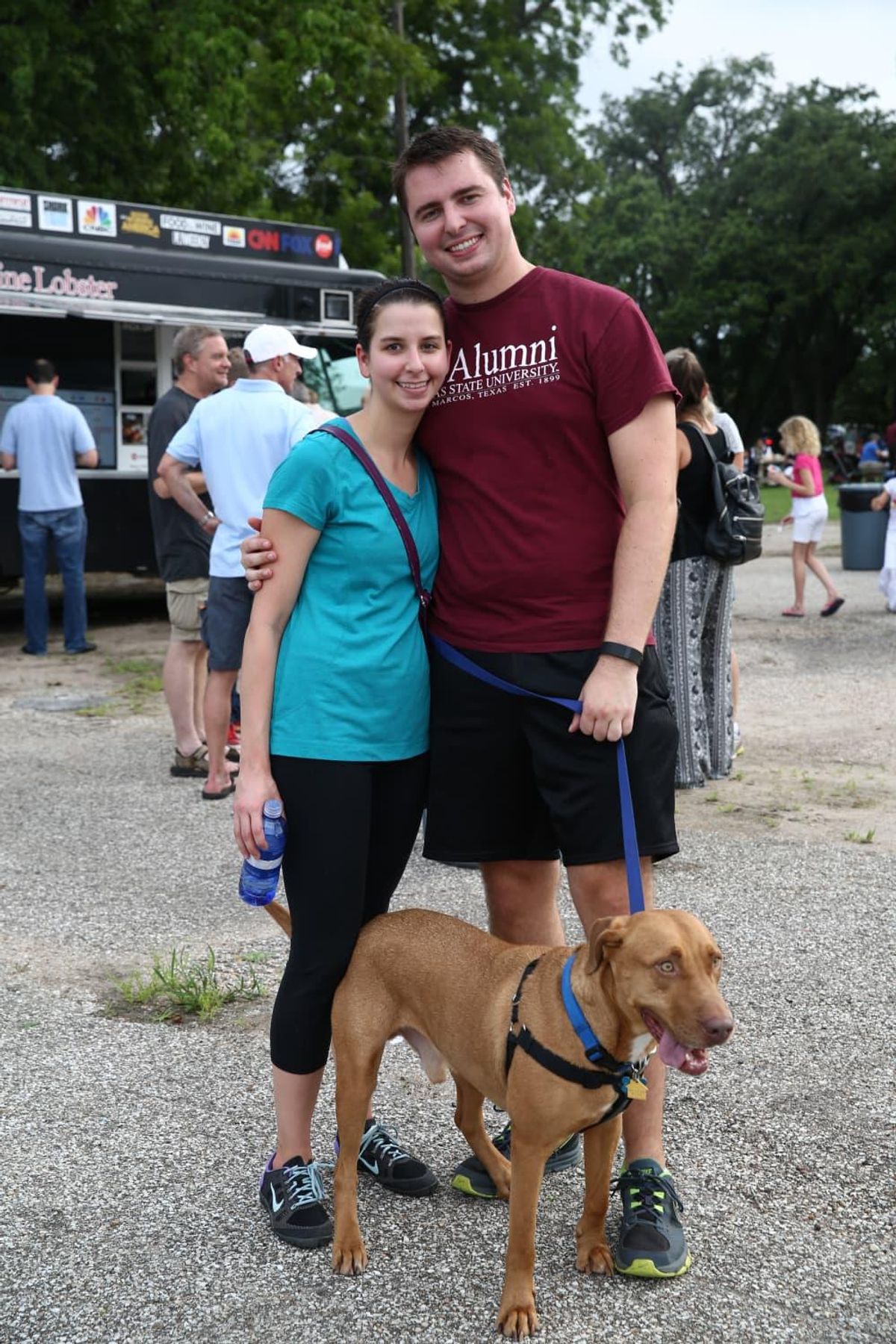 Kathryn Tears and Kyle Neely with Clifford. - CultureMap Houston