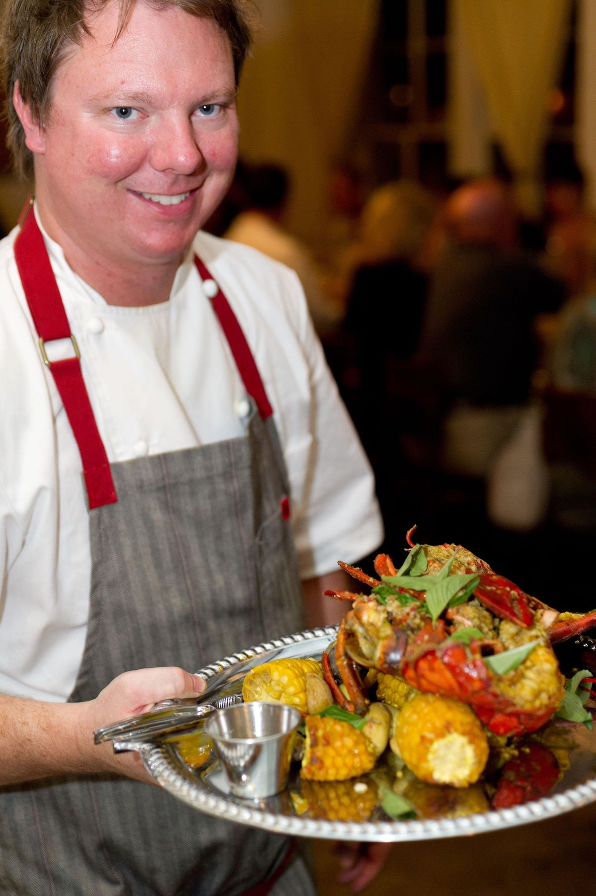 Chef Ben McPherson with his lobster platter. - CultureMap Houston