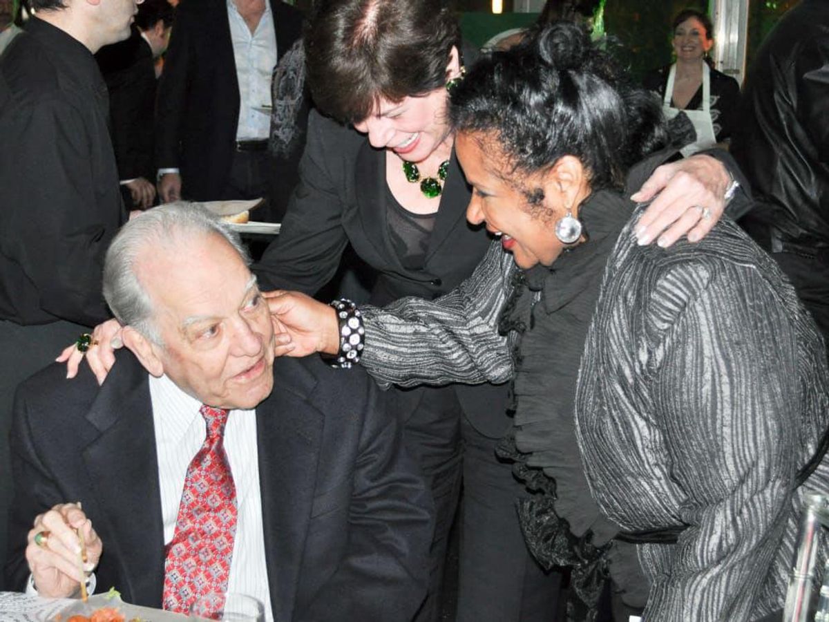 Dr. Del Delery, seated, with Andy Delery and songbird Yvonne Washington ...