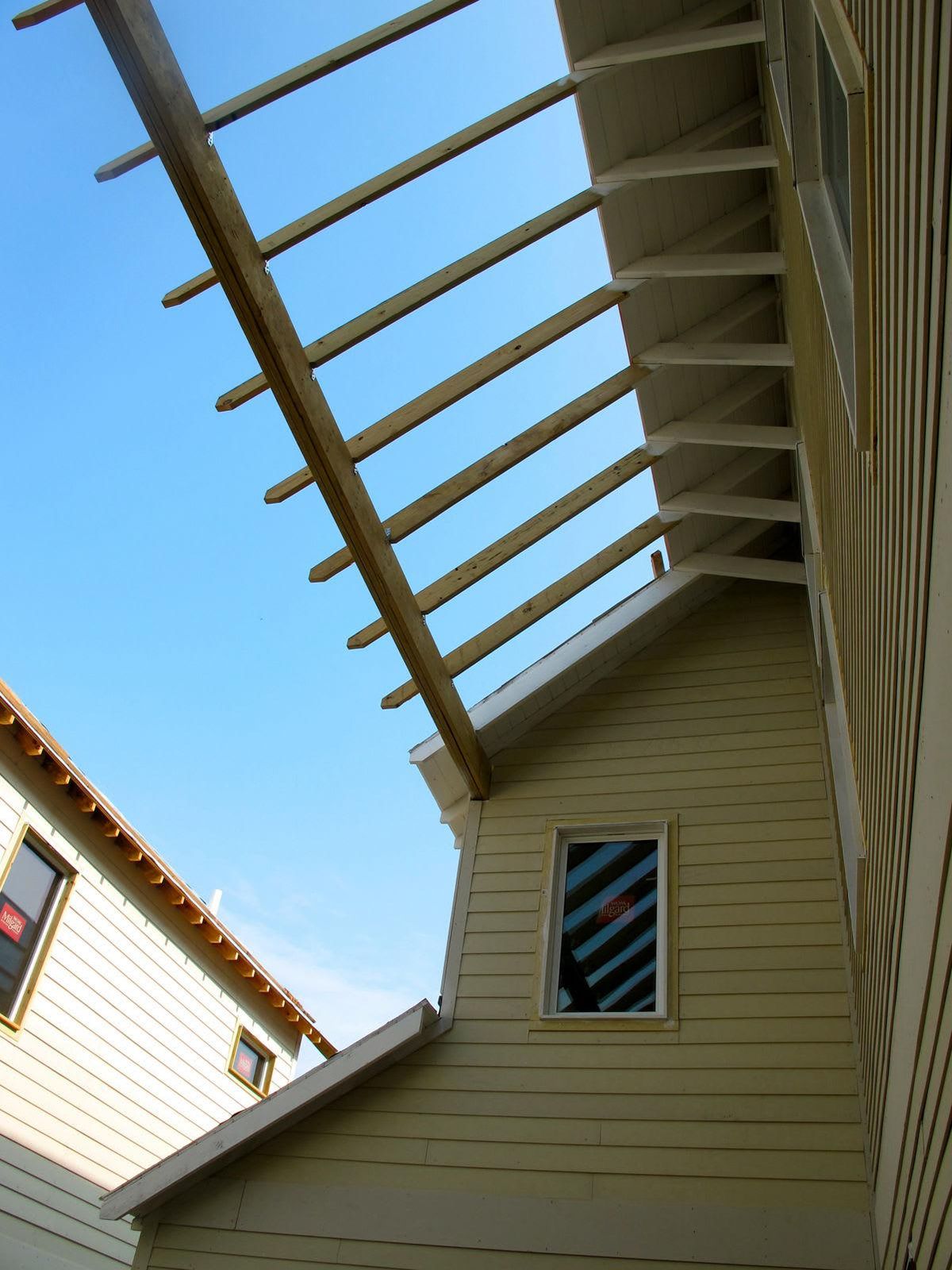 Decorative rafters above outside add architectural interest ...