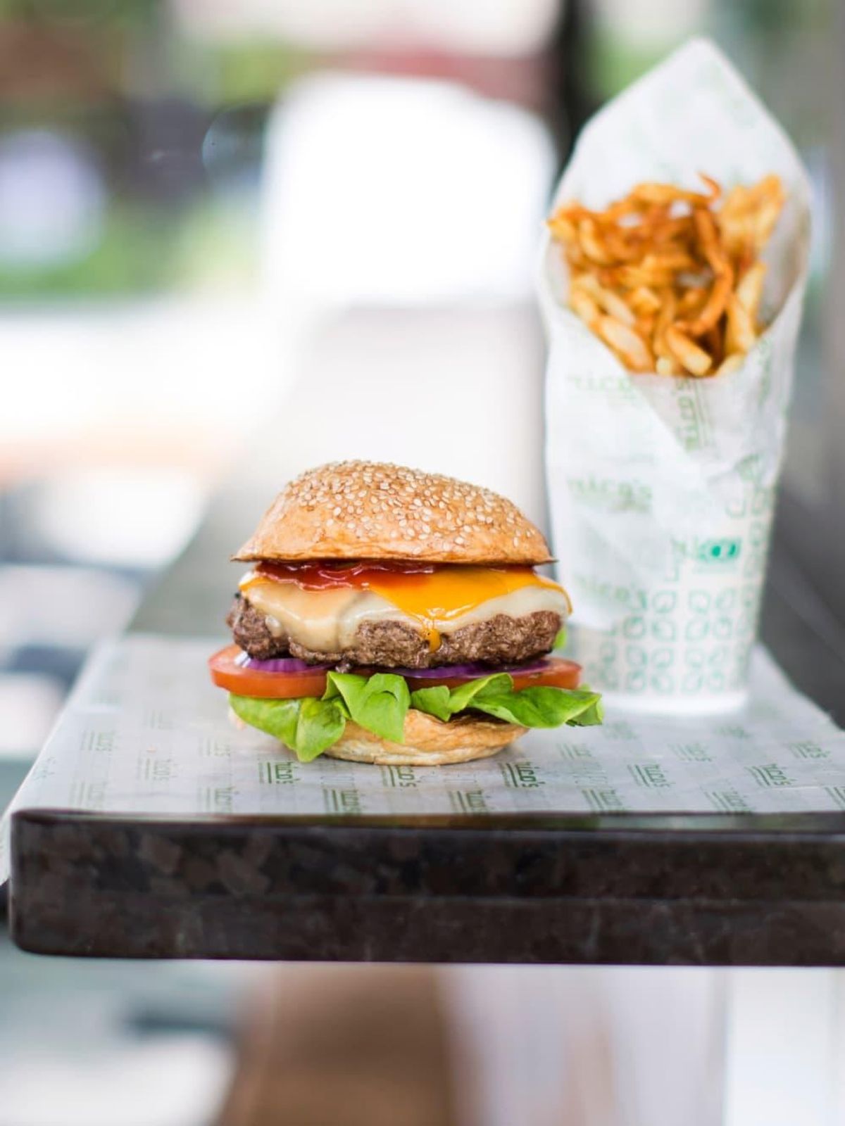 The park burger features a six-ounce patty, two kinds of cheese and a ...