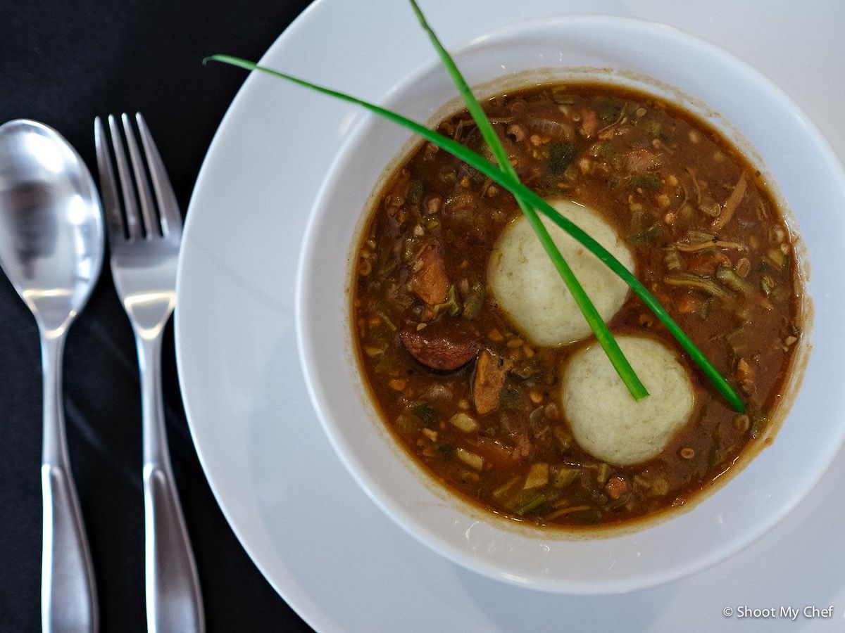 Chicken and sausage gumbo with matzah balls. - CultureMap Houston