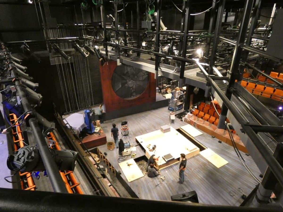 Climbing the catwalks of the Sterling Stage. - CultureMap Houston