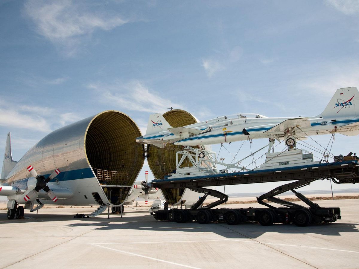 A NASA Super Guppy "swallows" two NASA T-38 aircraft ready for ...