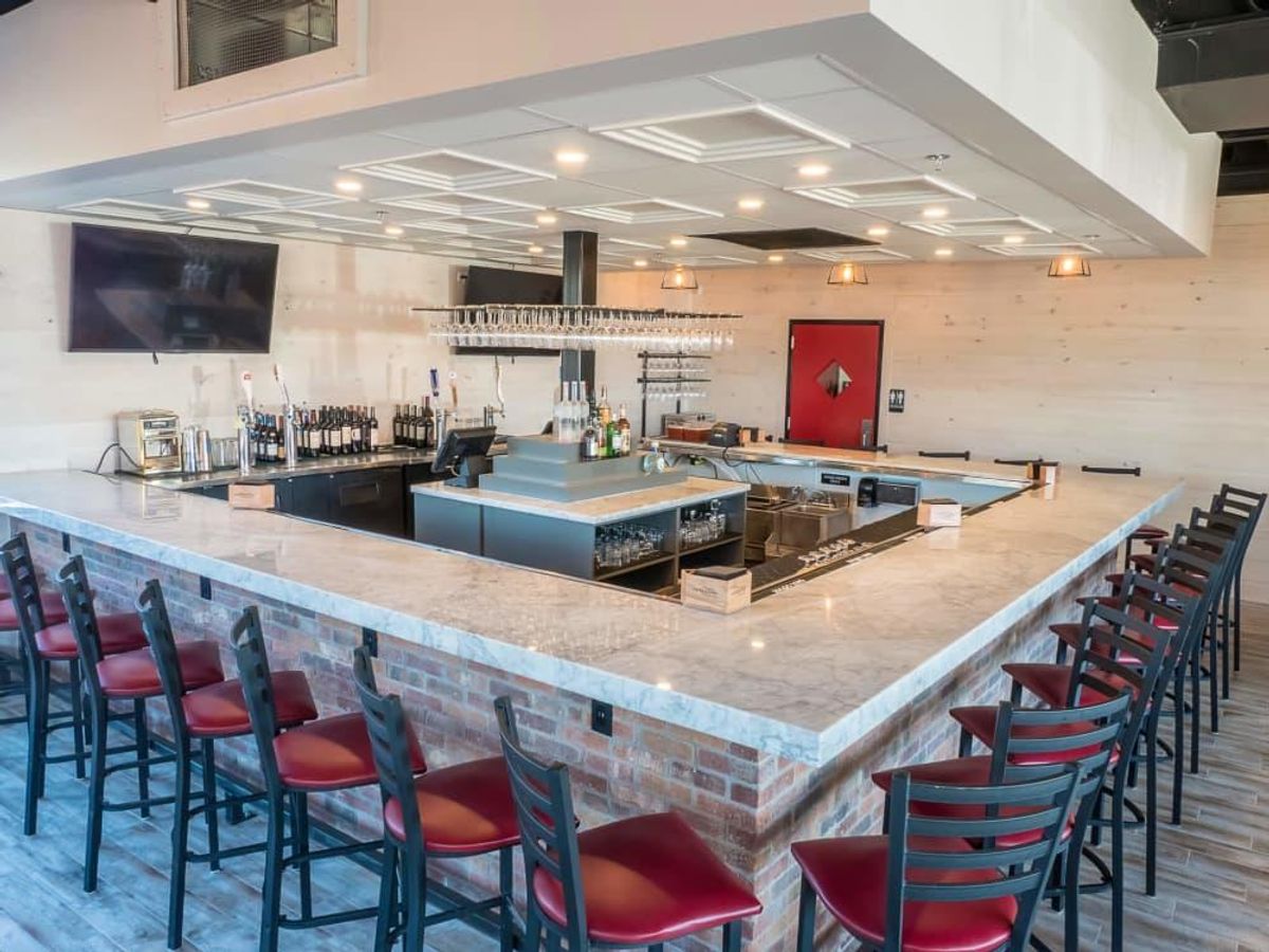 The new Union Kitchen features an expansive bar. - CultureMap Houston